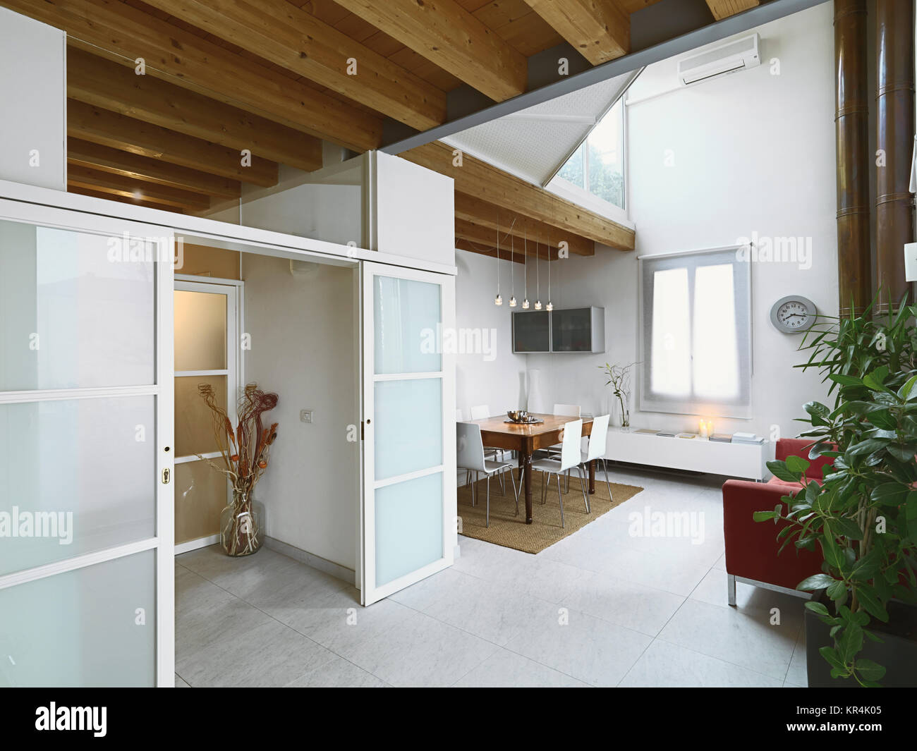 interior view of modern living room with dining table an wood ceiling ...