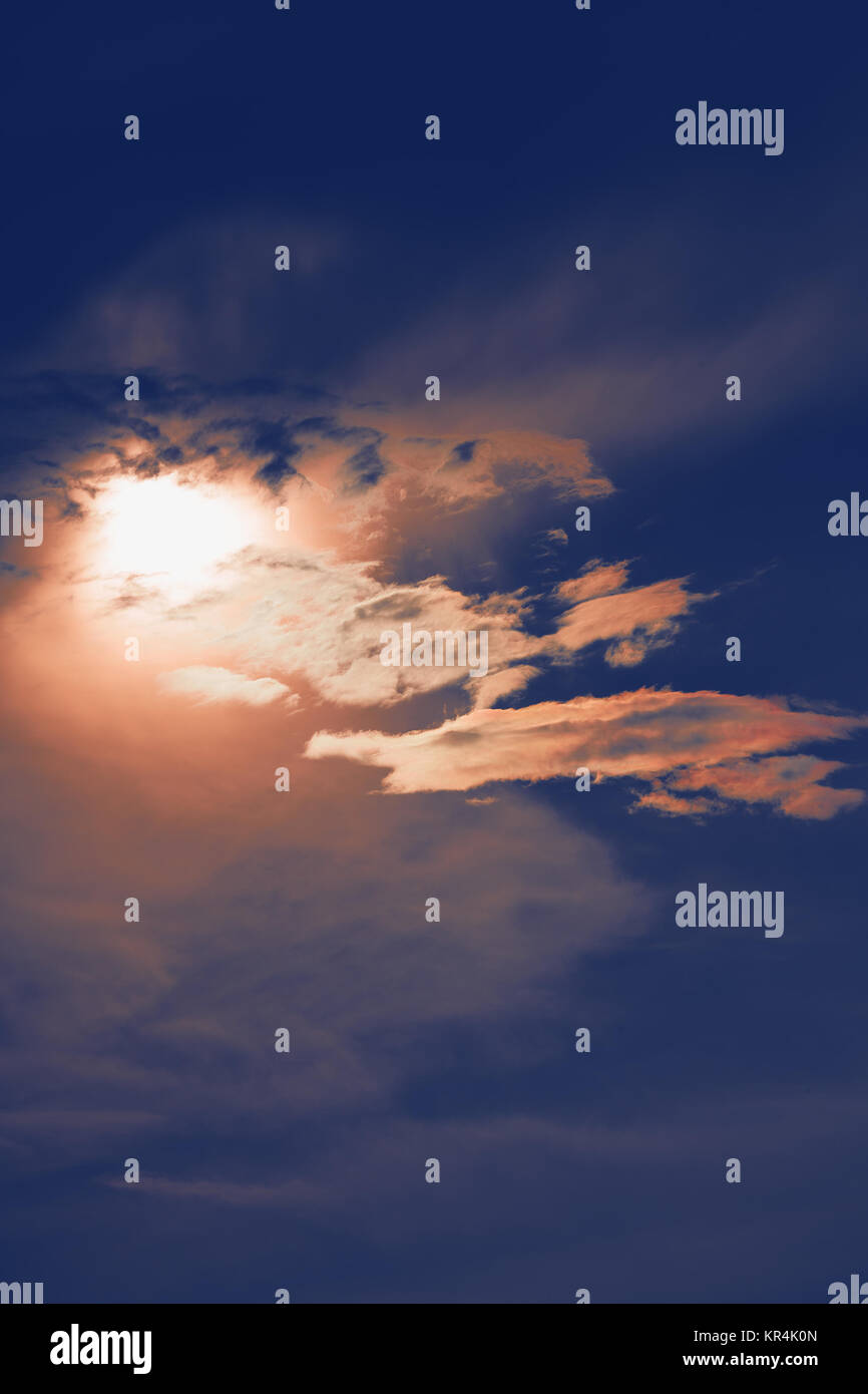 sunset with sun clouds over clouds Stock Photo - Alamy