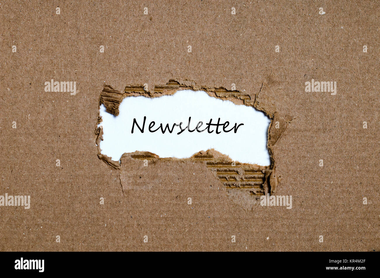 The word newsletter appearing behind torn paper Stock Photo - Alamy