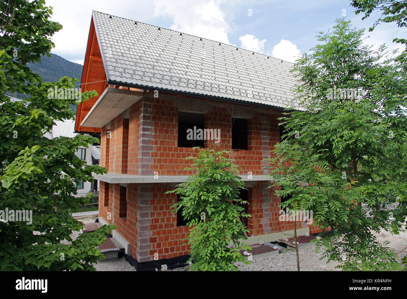 the construction of a house. newly built brick house Stock Photo - Alamy