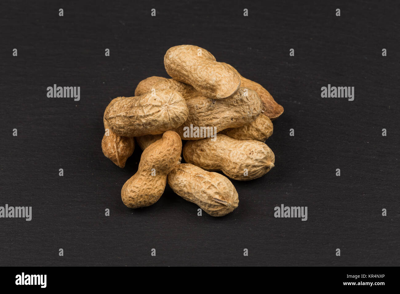 Raw peanuts shells Stock Photo - Alamy
