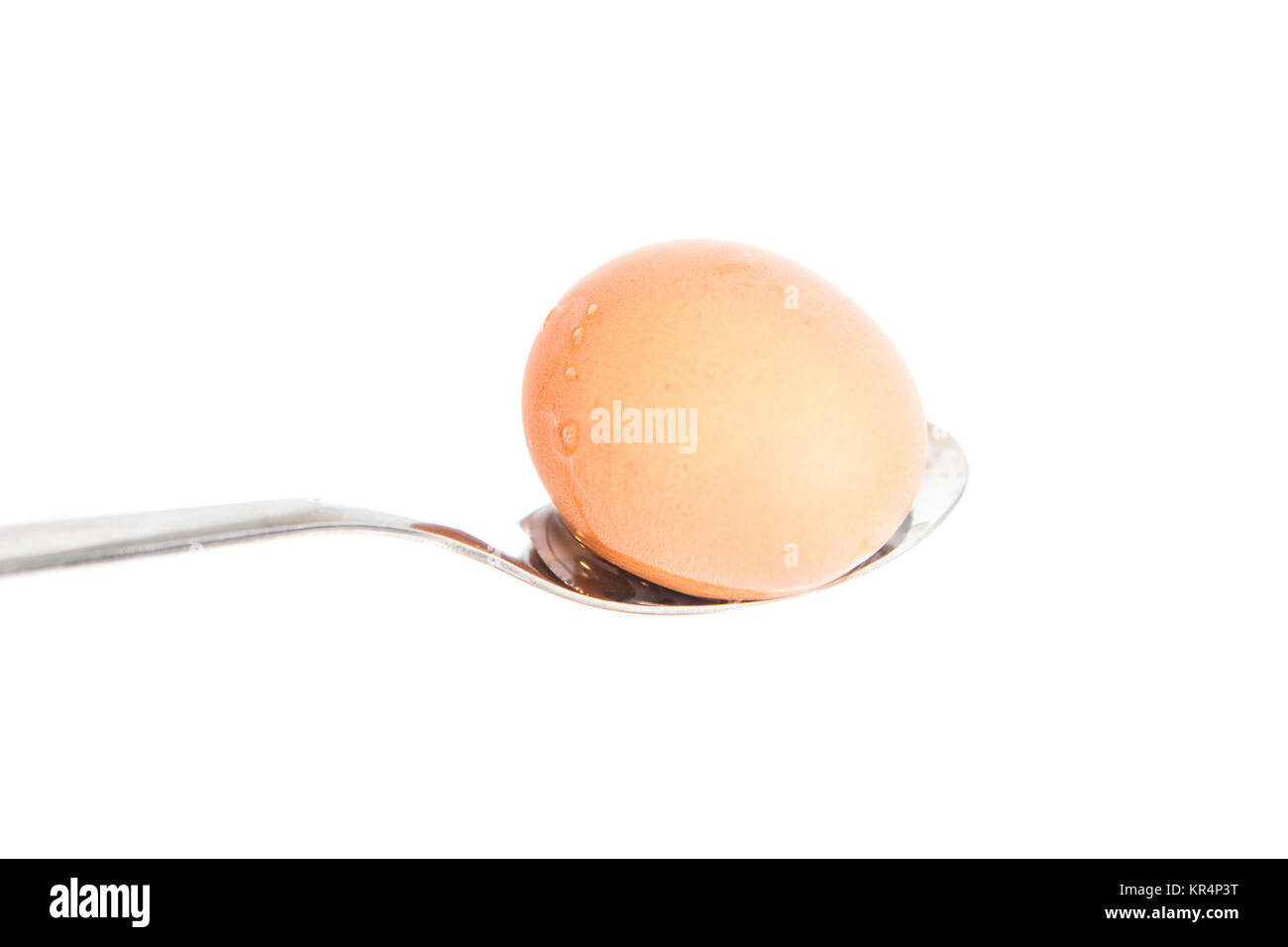 egg on a spoon, isolated on white background Stock Photo - Alamy