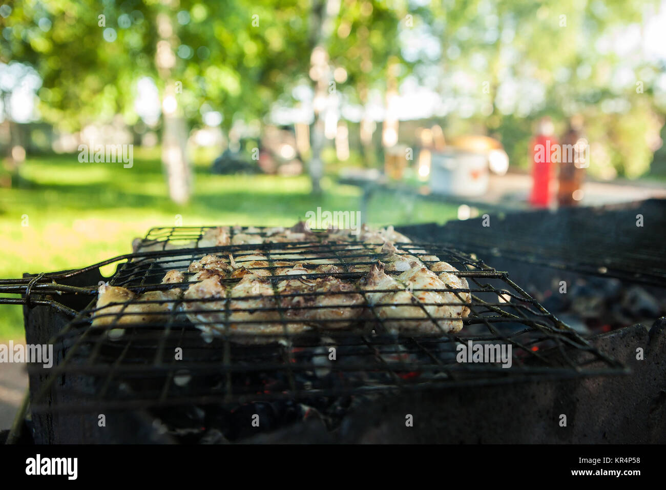 chicken breast grilled with flames. Preparation of meat slices in sauce ...