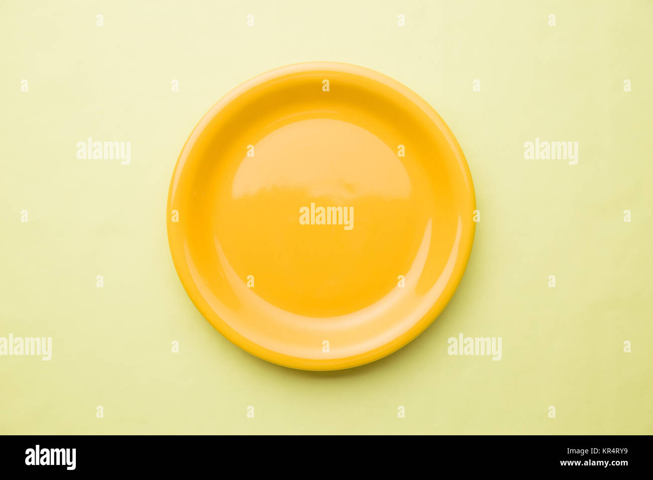 empty yellow plate Stock Photo - Alamy