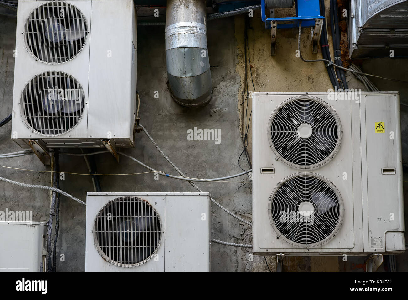 Group of air conditioner units outside building Stock Photo - Alamy