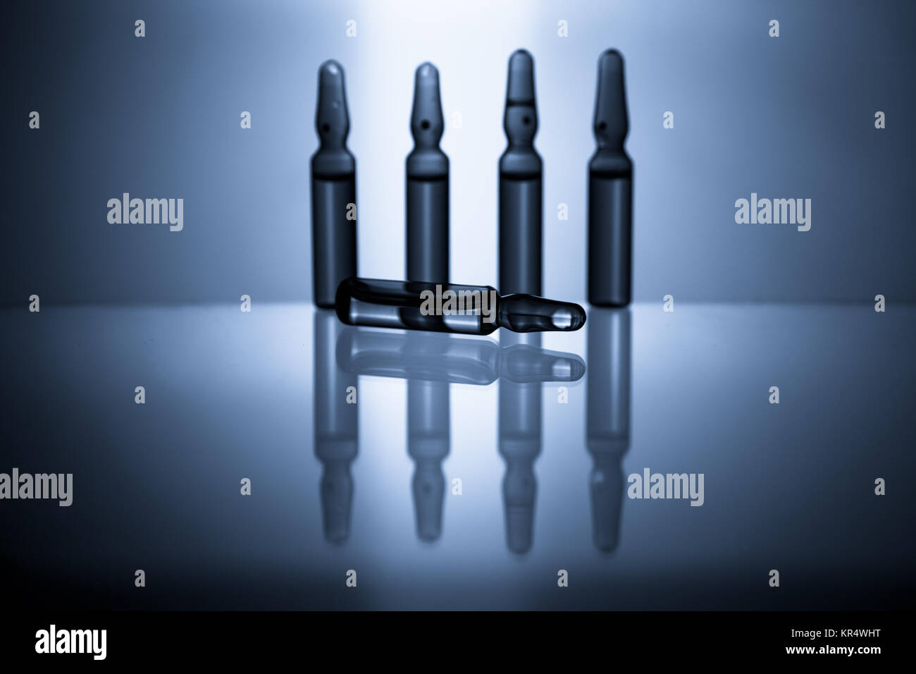 Medical ampules for injection isolated on blue background. Ampoules ...