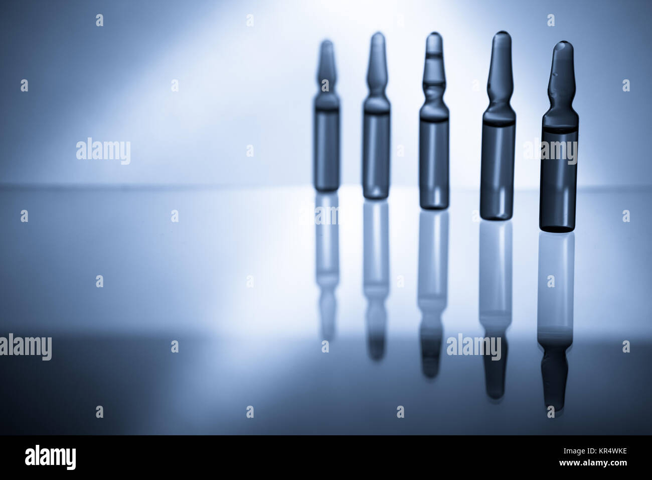 Medical ampules for injection isolated on blue background. Ampoules ...