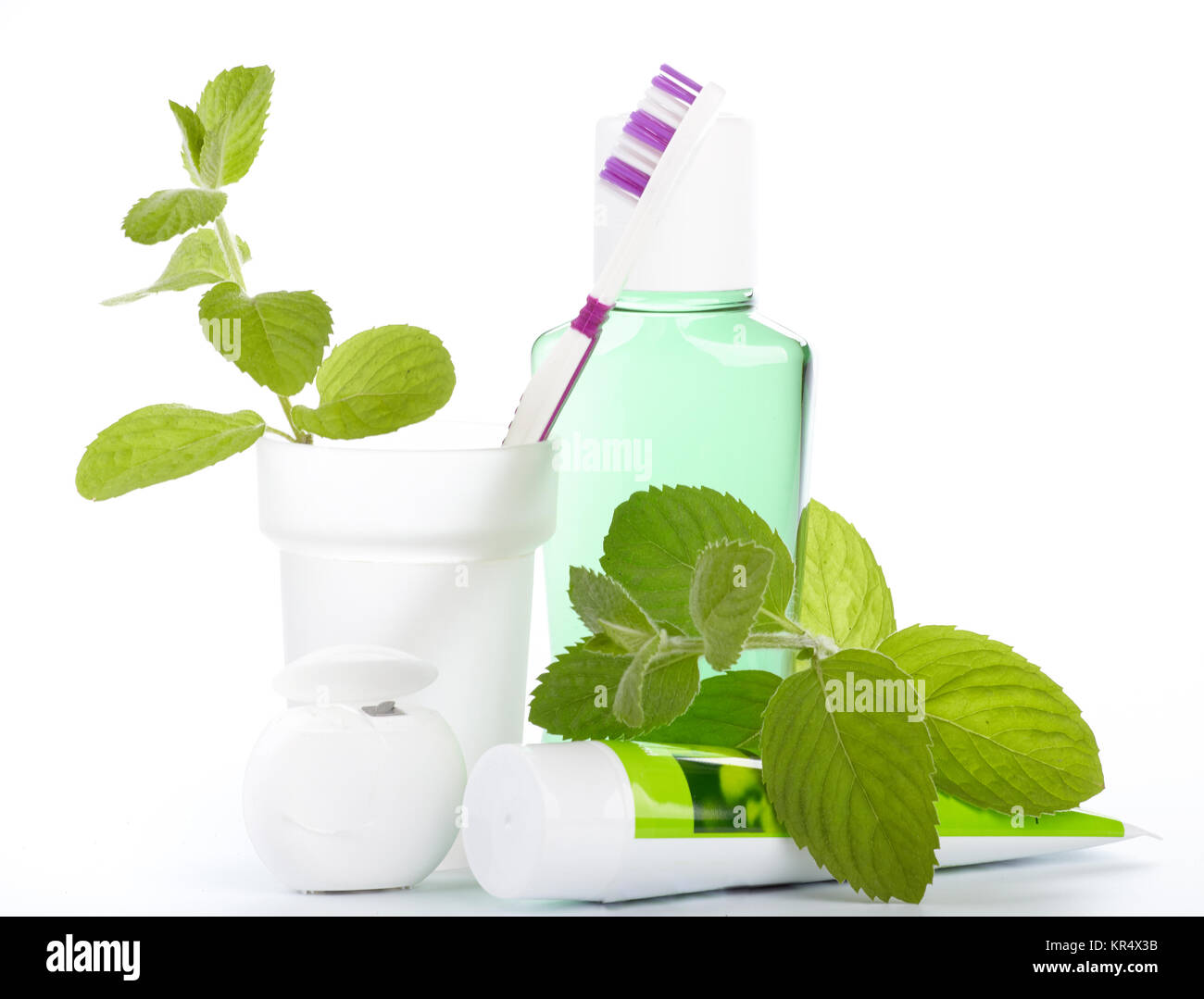 Toothbrush with toothpaste and fresh leaves of mint Stock Photo - Alamy