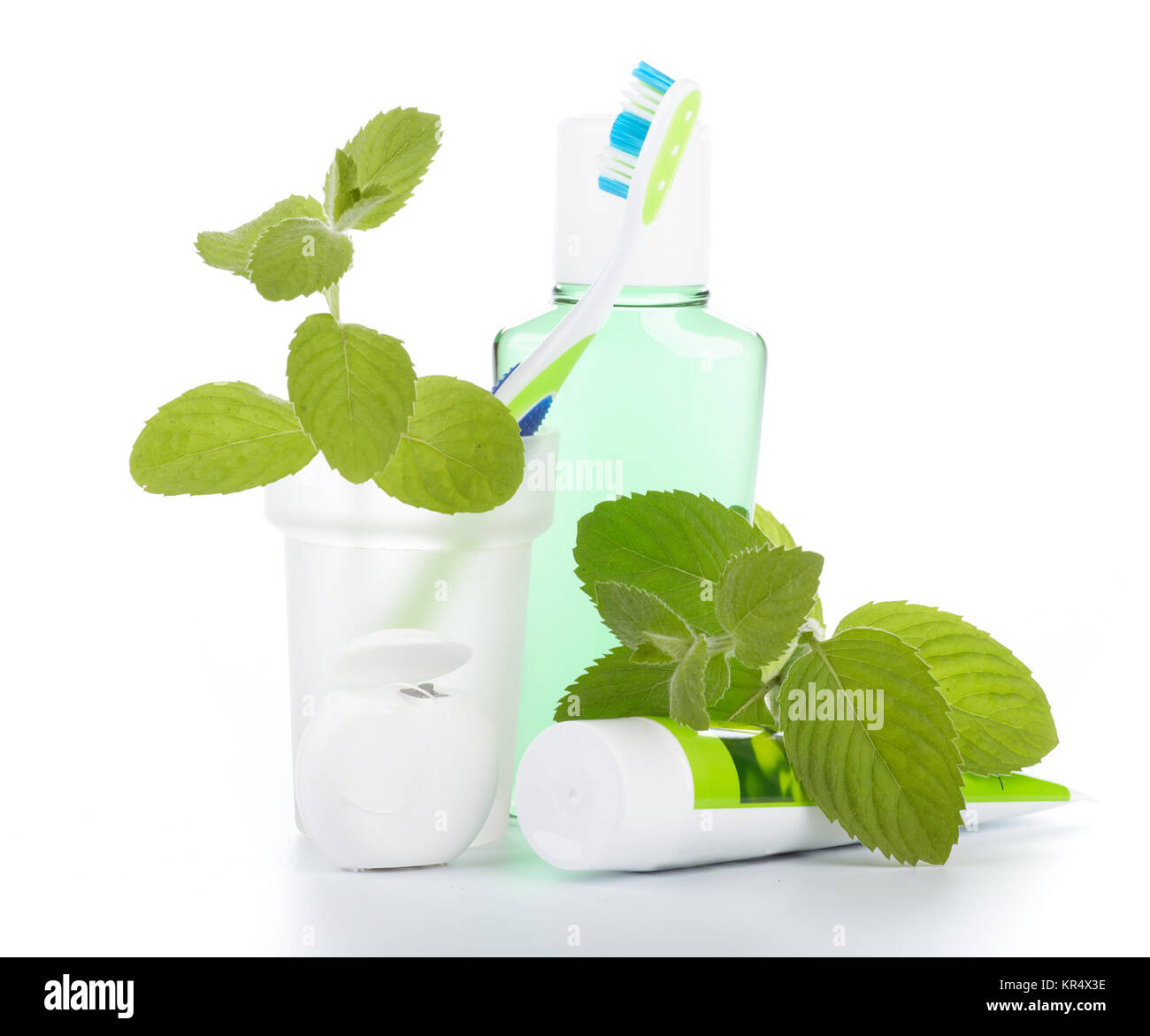 Toothbrush with toothpaste and fresh leaves of mint Stock Photo - Alamy
