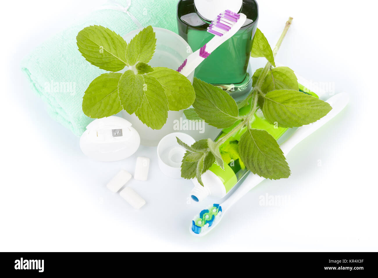 Toothbrush with toothpaste and fresh leaves of mint Stock Photo - Alamy