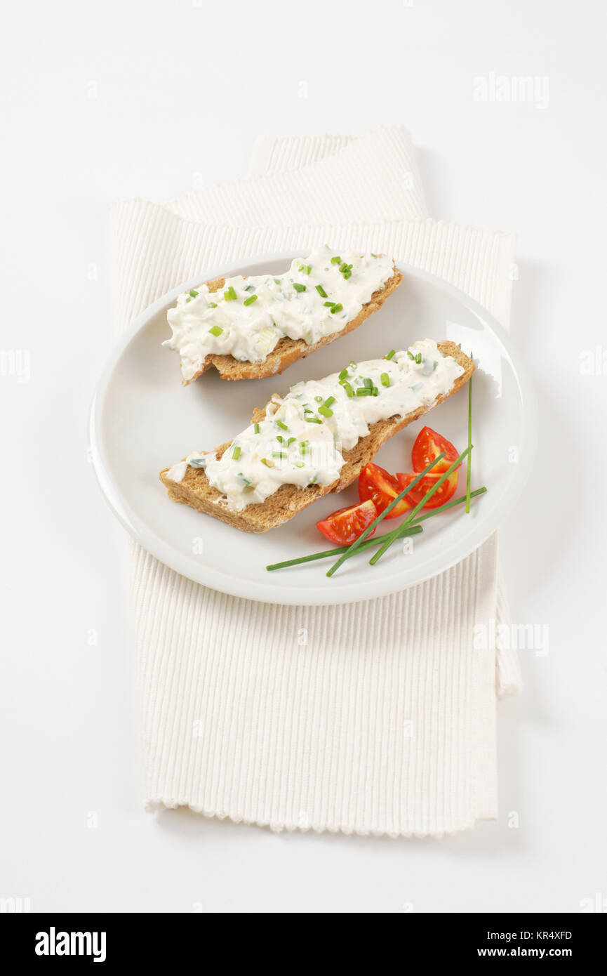 bread roll with cheese spread Stock Photo - Alamy