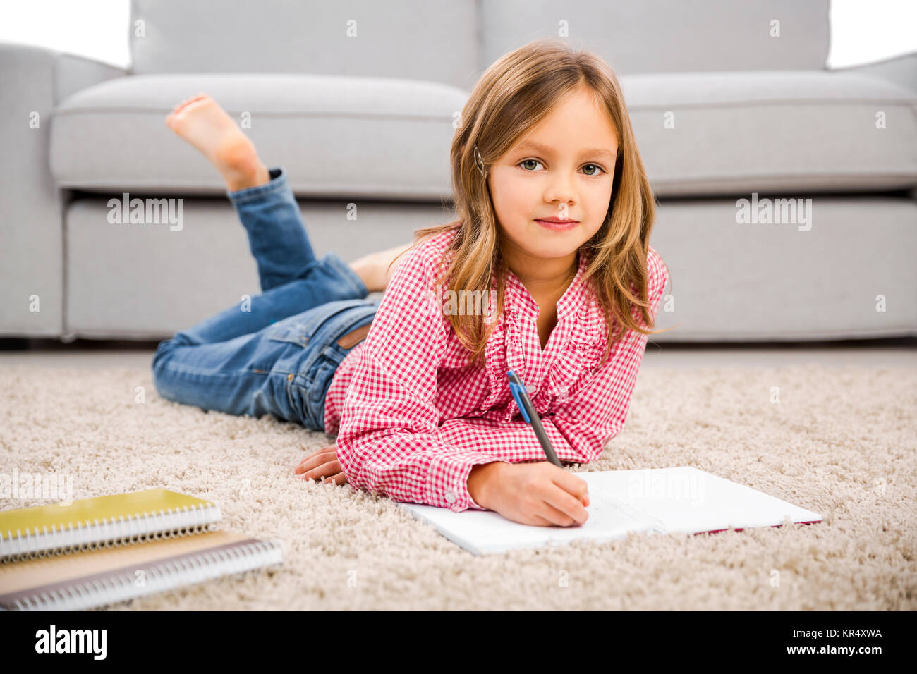 Little girl making homework Stock Photo - Alamy
