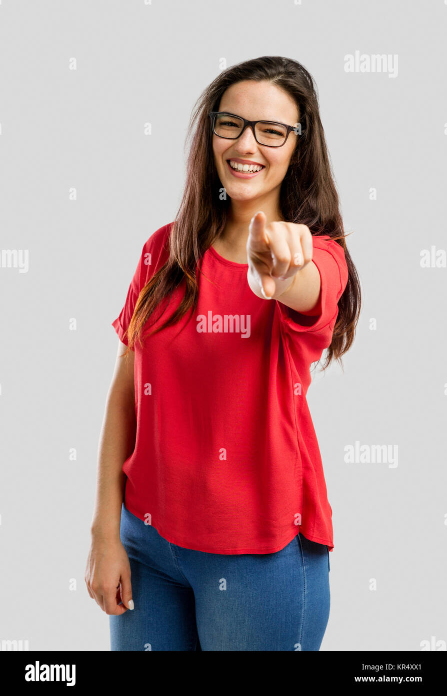 Happy woman pointing to the camera Stock Photo - Alamy