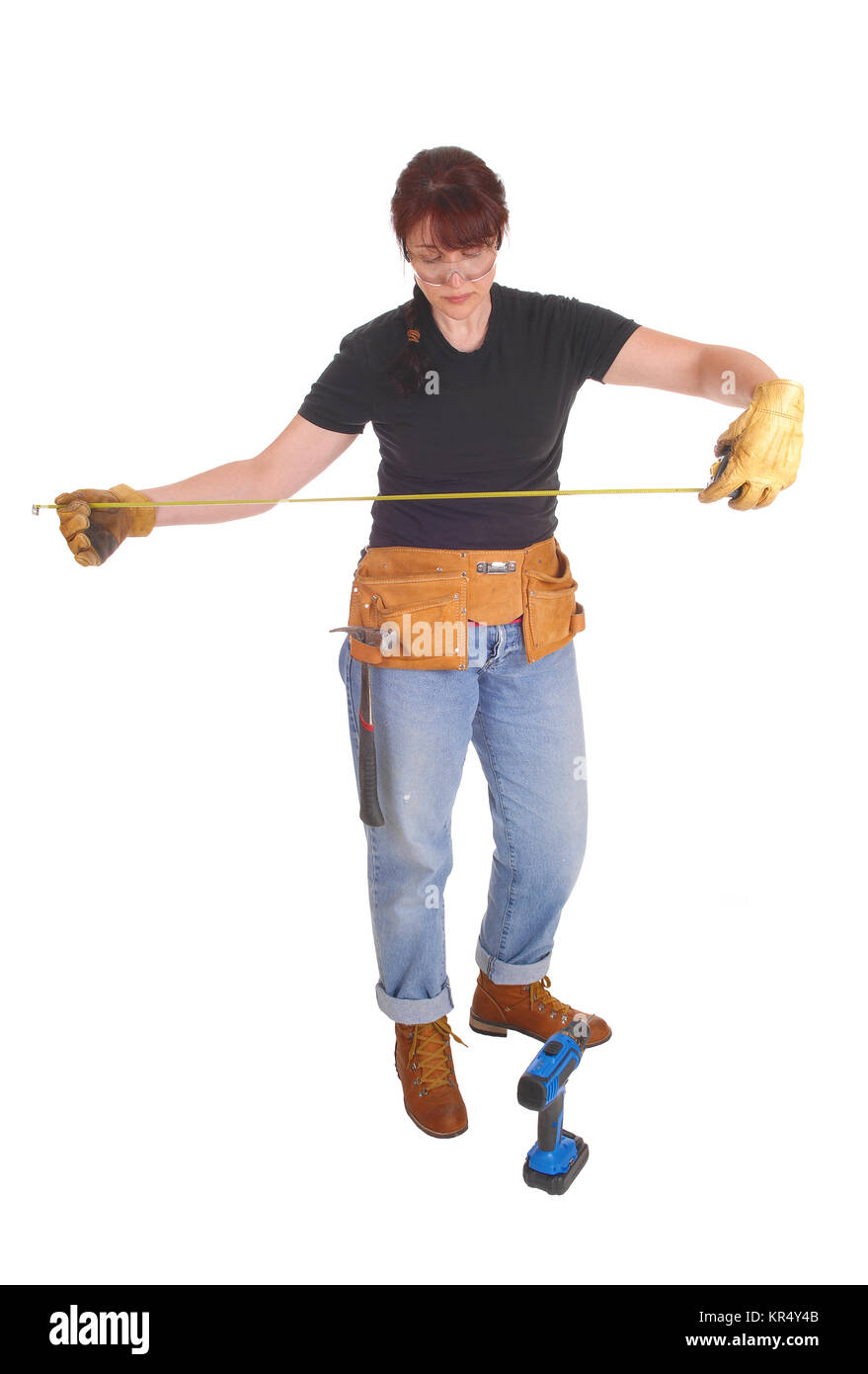 A handy woman measuring for work Stock Photo - Alamy