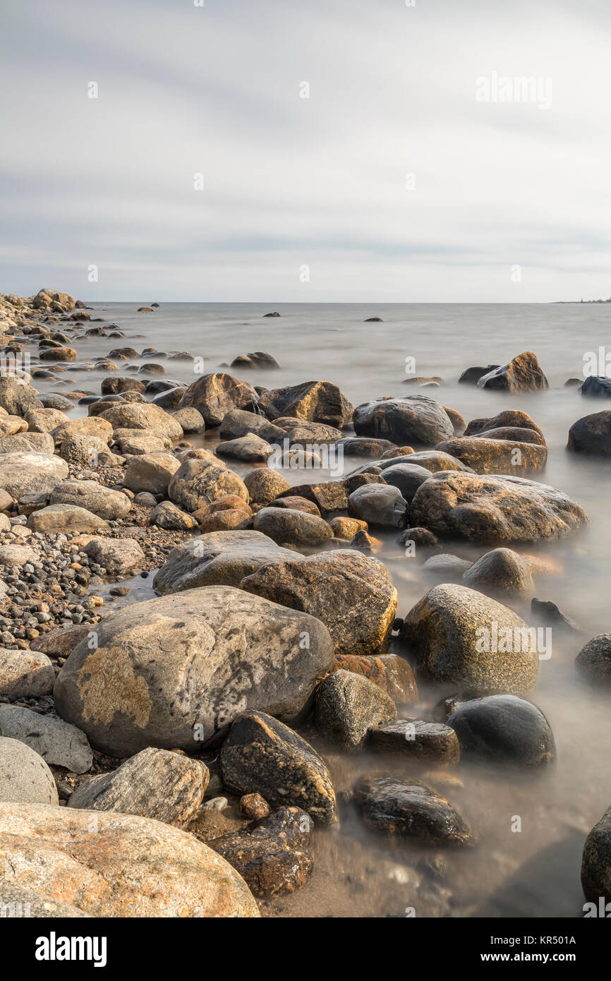 Rocky Shoreline over Ocean Stock Photo - Alamy