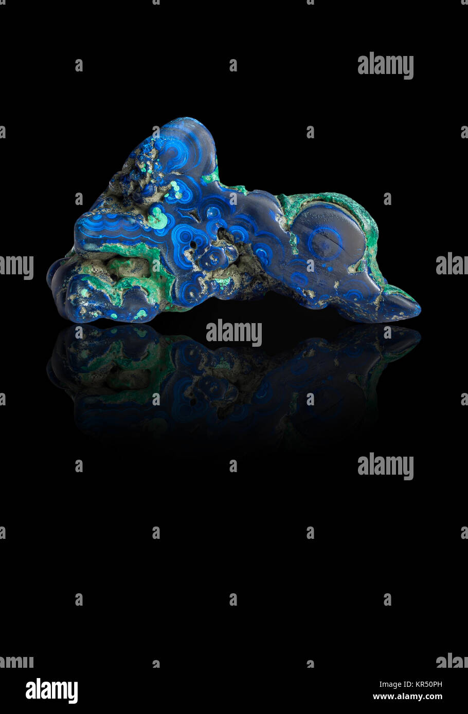 Blue and green Azurite gemstone with ground reflection on the black ...