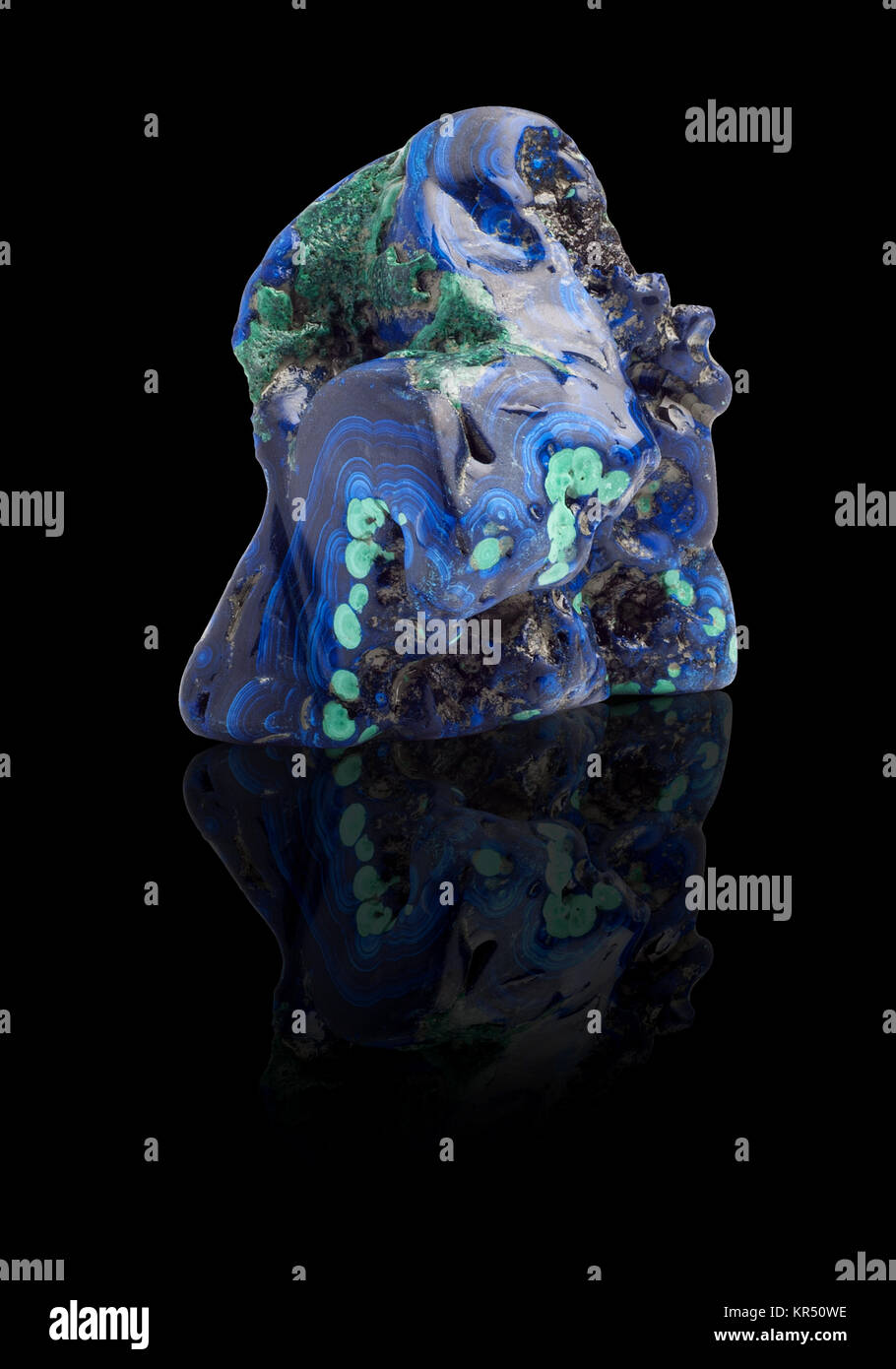 Blue and green Azurite gemstone with ground reflection on the black ...