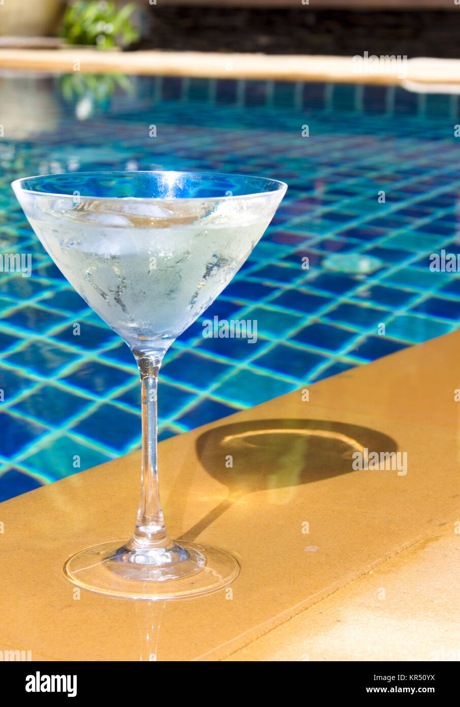 Cool cocktail standing by swimming pool Stock Photo - Alamy