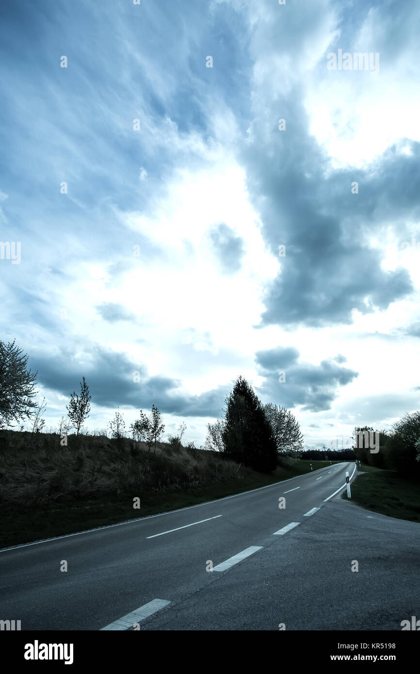 A road under a dramatic Sky Stock Photo - Alamy