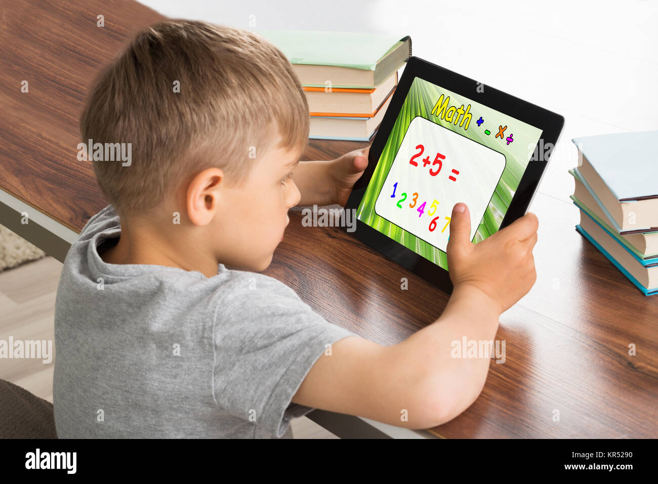Pupil Solving Math Problem On Digital Tablet Stock Photo - Alamy