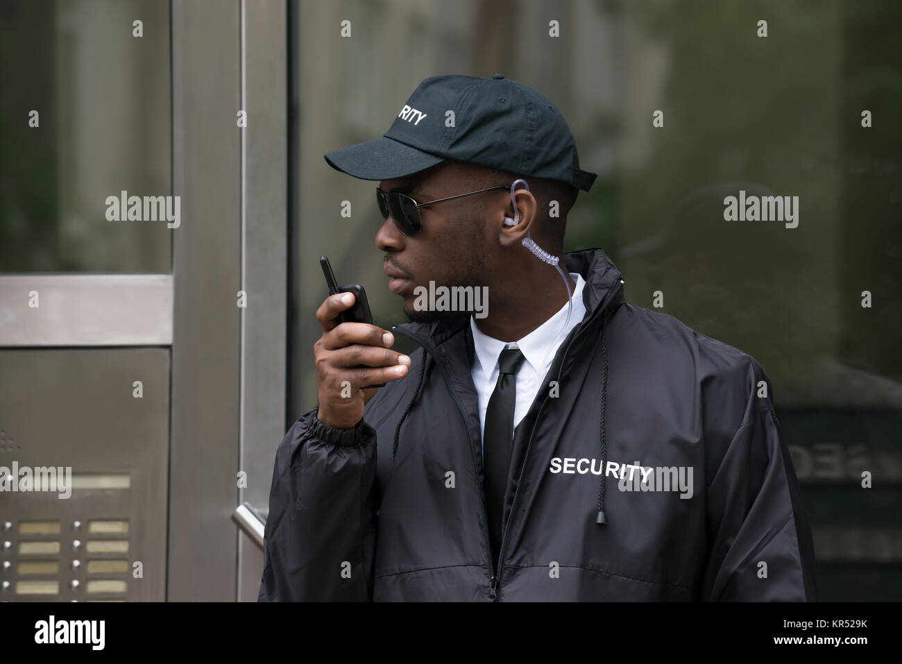 Policeman using walkie talkie hi-res stock photography and images - Alamy