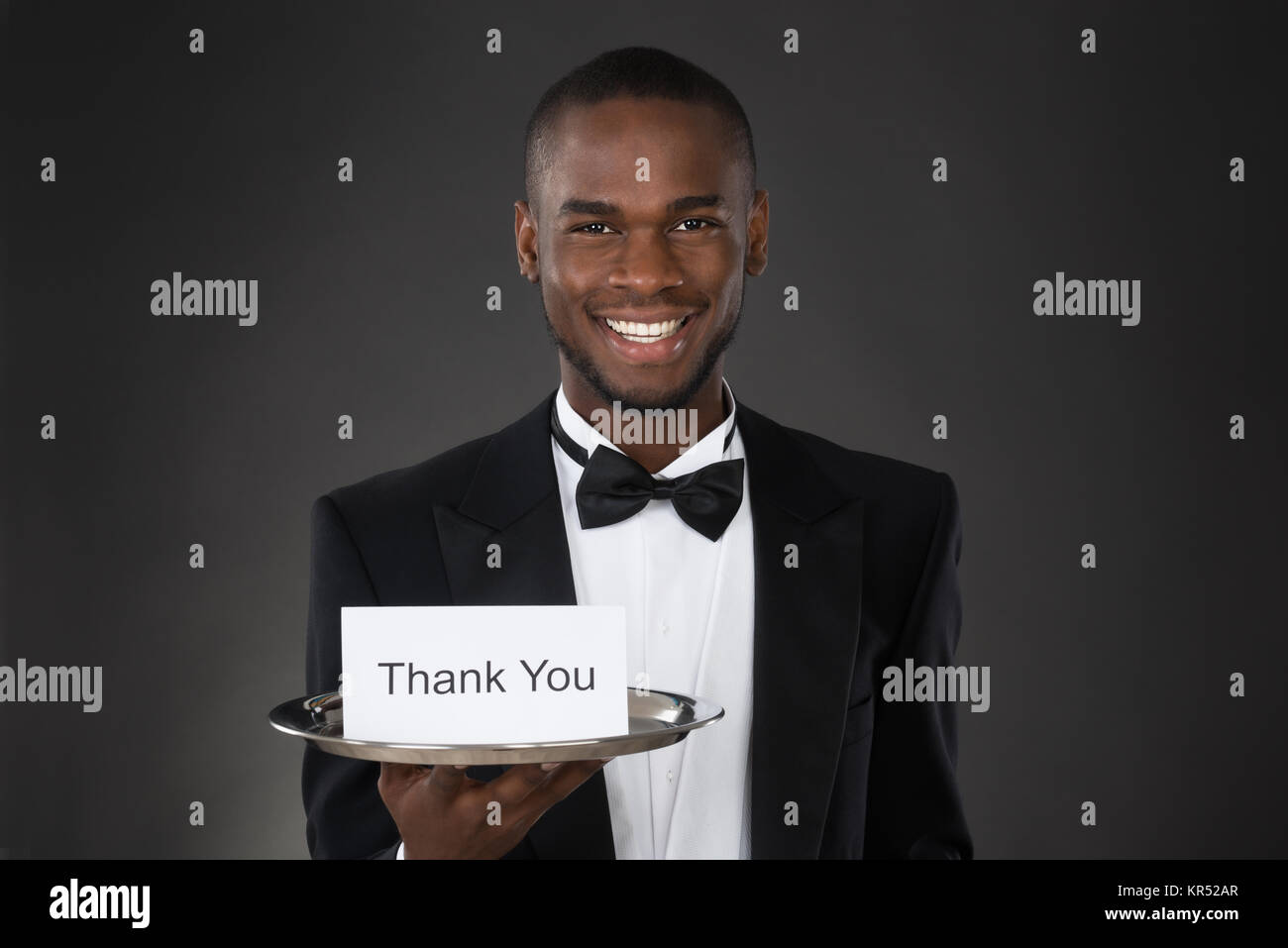 Waiter Showing Thank You Card Stock Photo - Alamy