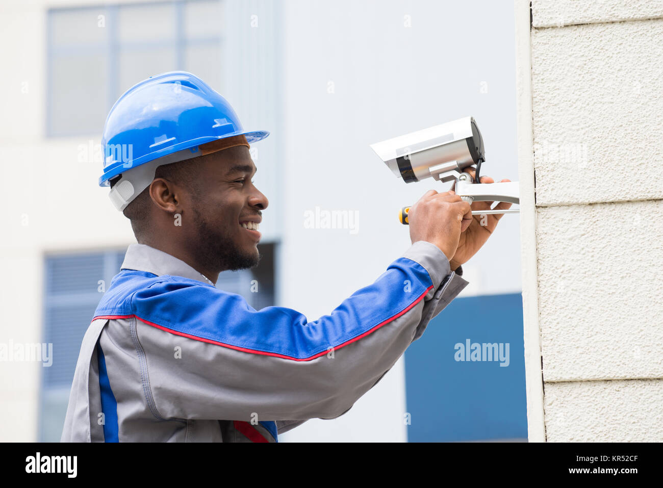 Male Technician Repairing Camera Stock Photo - Alamy
