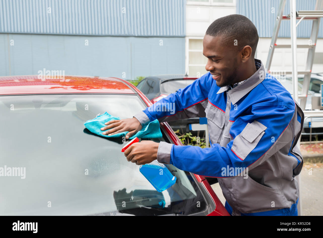 Male Worker Cleaning Car Windshield Stock Photo - Alamy