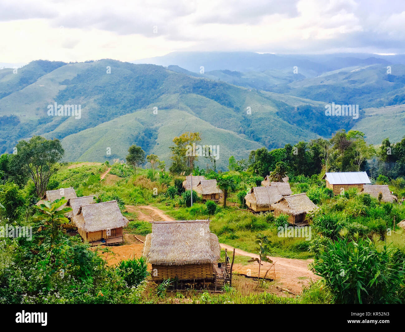 Local rural houses with mountains background Stock Photo - Alamy