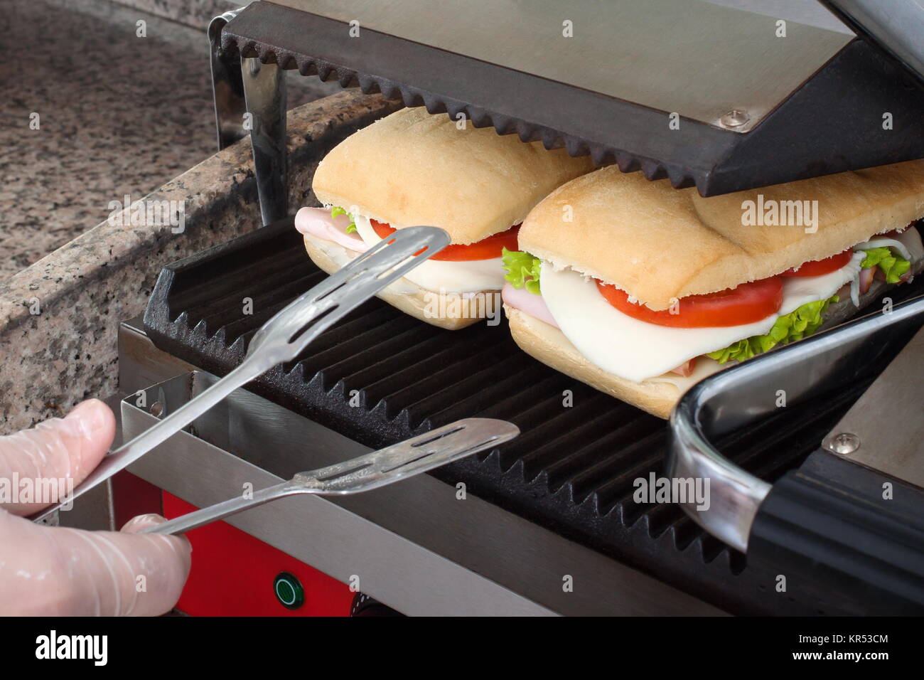 Cook tasty toasted sandwiches Stock Photo - Alamy