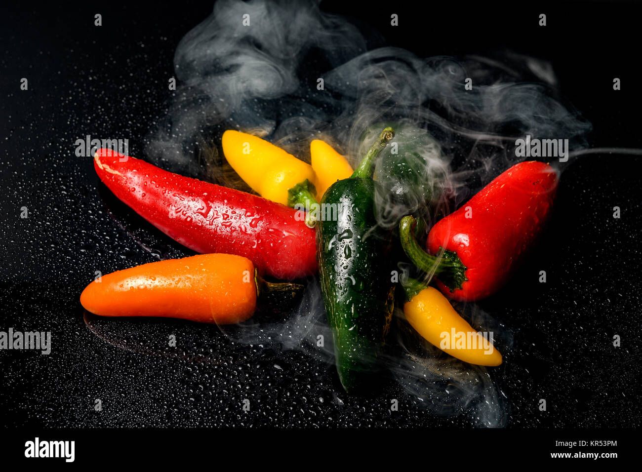 spicy red chilli shrouded in smoke Stock Photo - Alamy