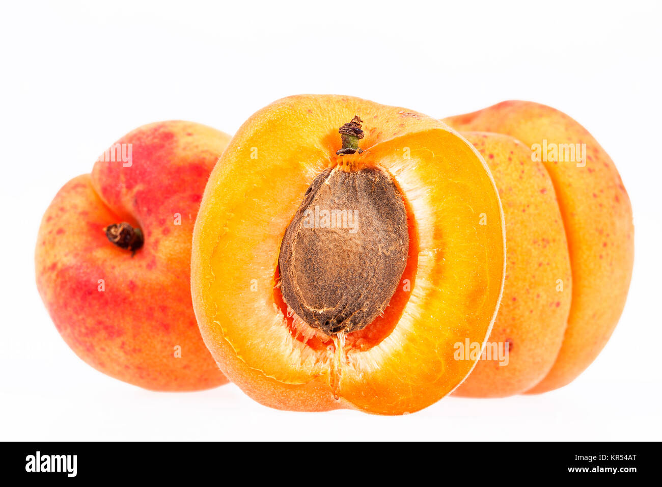 Whole and cut fruits of apricot isolated on white background, close up ...