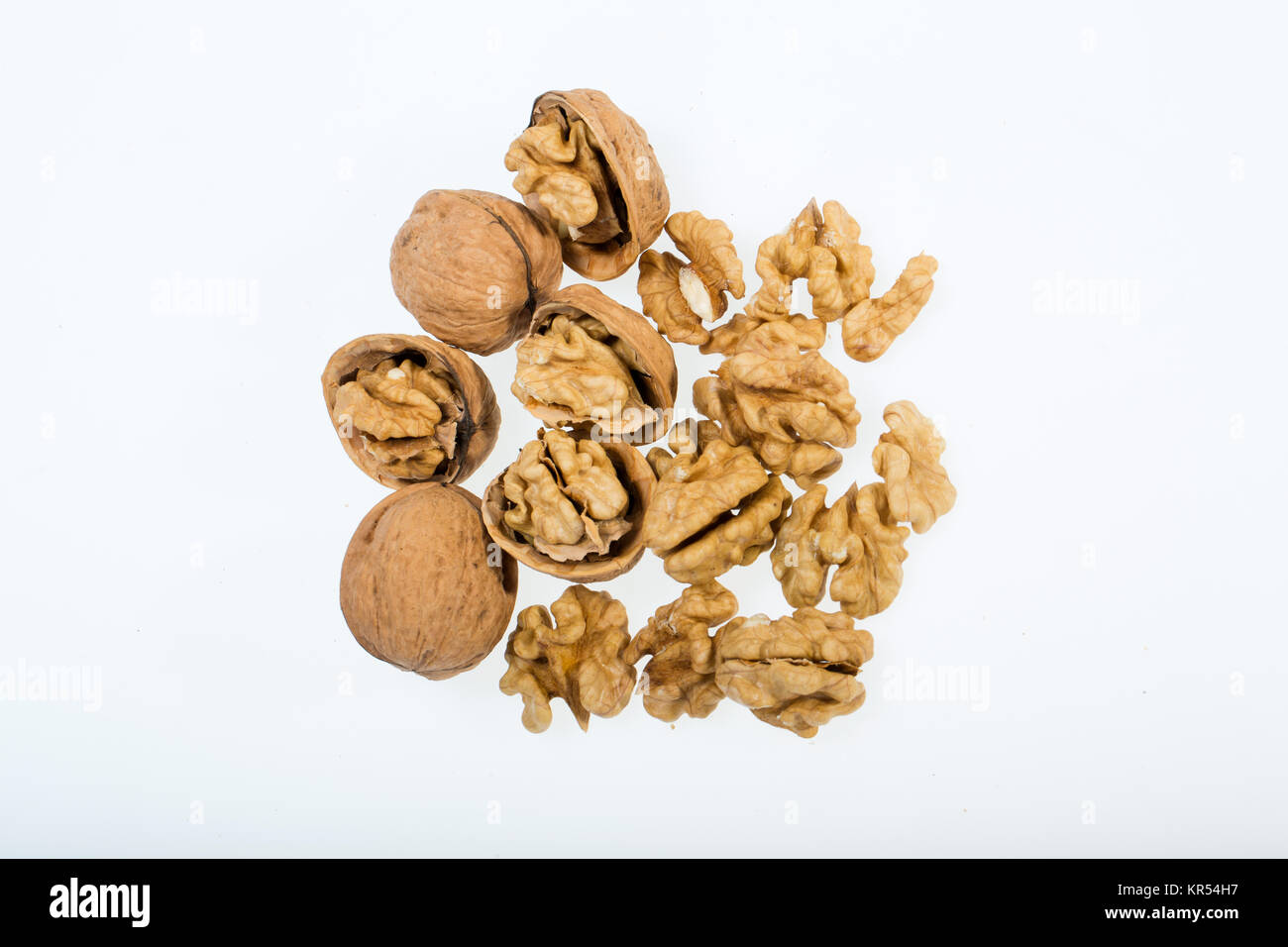 walnut and a cracked walnut isolated on the white background Stock ...