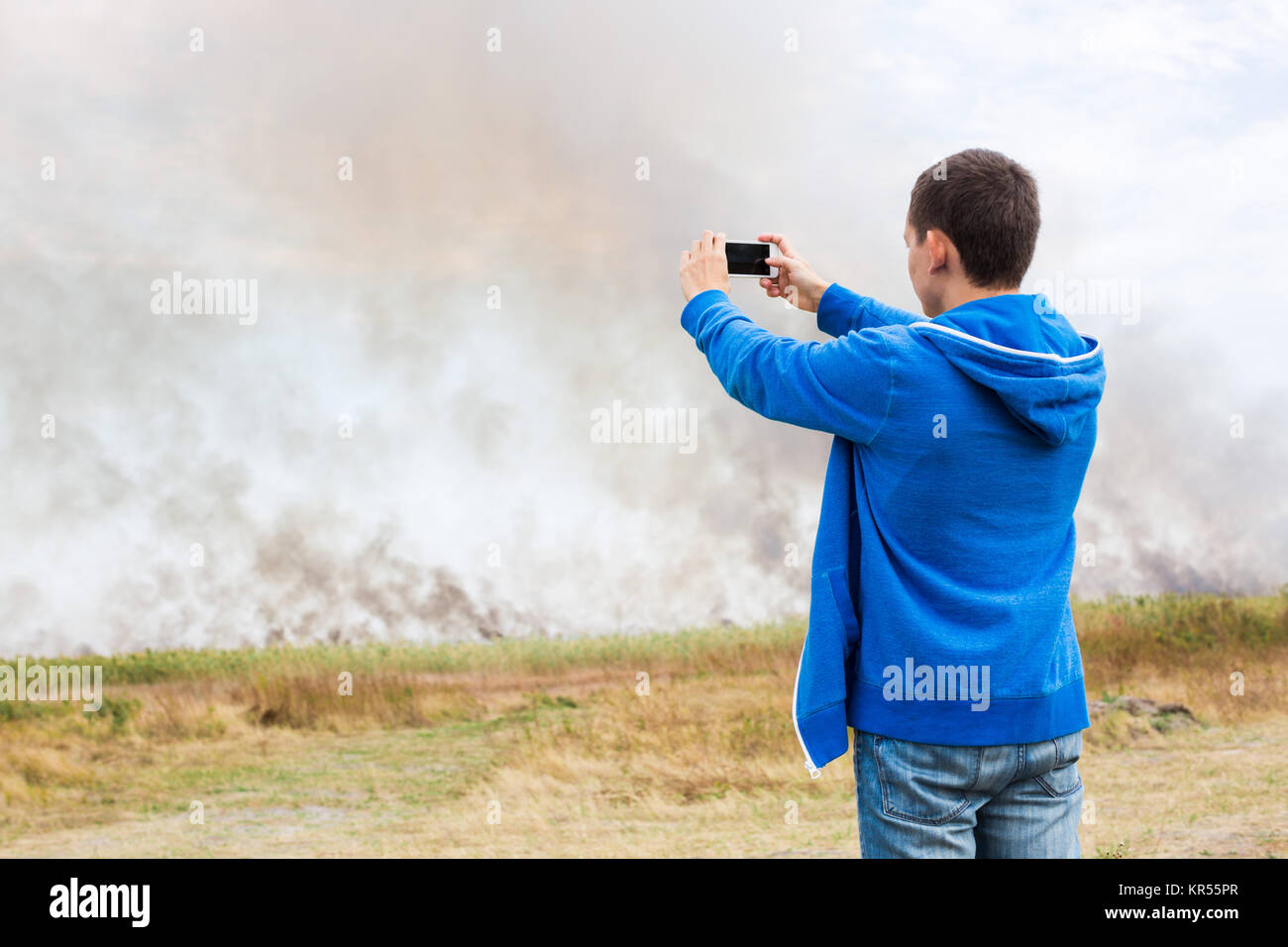 the person holding in hand cell phone with camera which he photographs ...