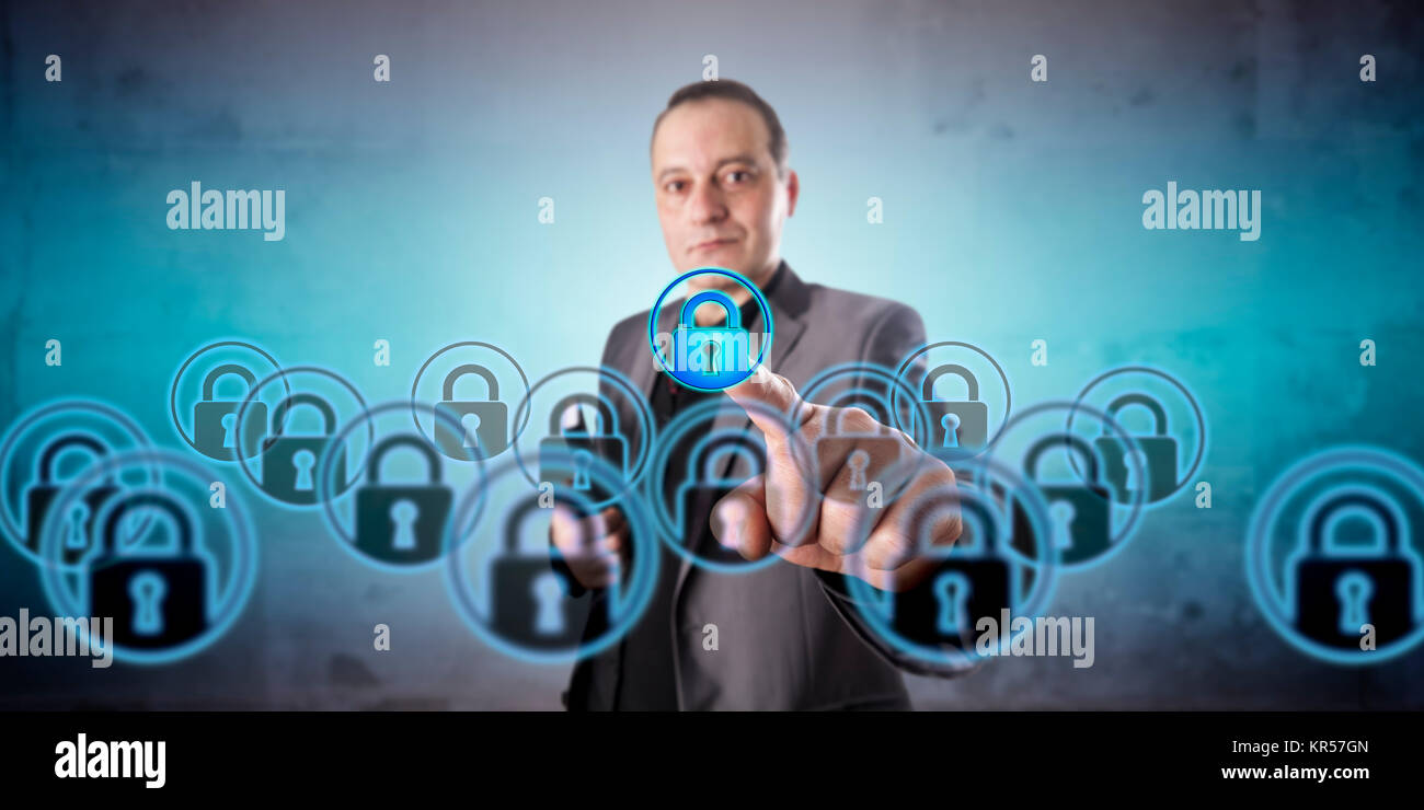 Man Picking A Virtual Lock Among Many Multiples Stock Photo - Alamy