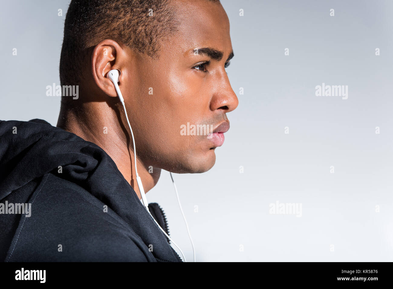 Profile Portrait Of Young African American Man Listening Music In