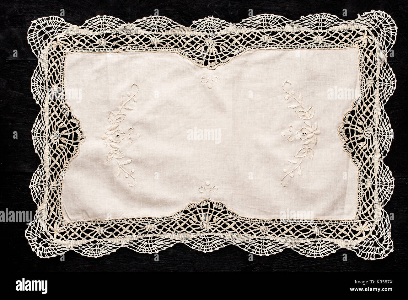 Old vintage napkin with lace border on the black wooden table Stock ...