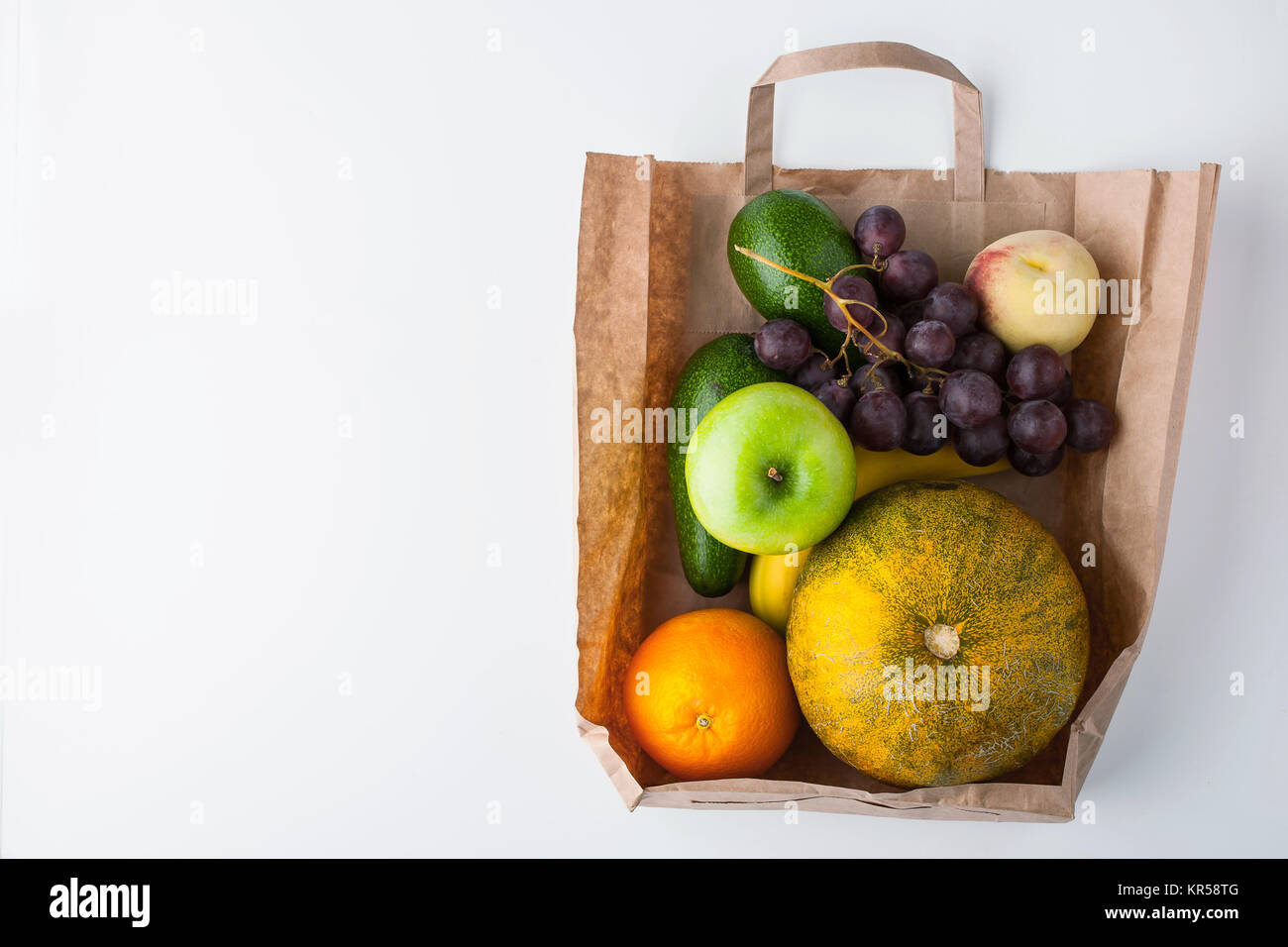 Assorted fruit inside a paper bag Stock Photo - Alamy
