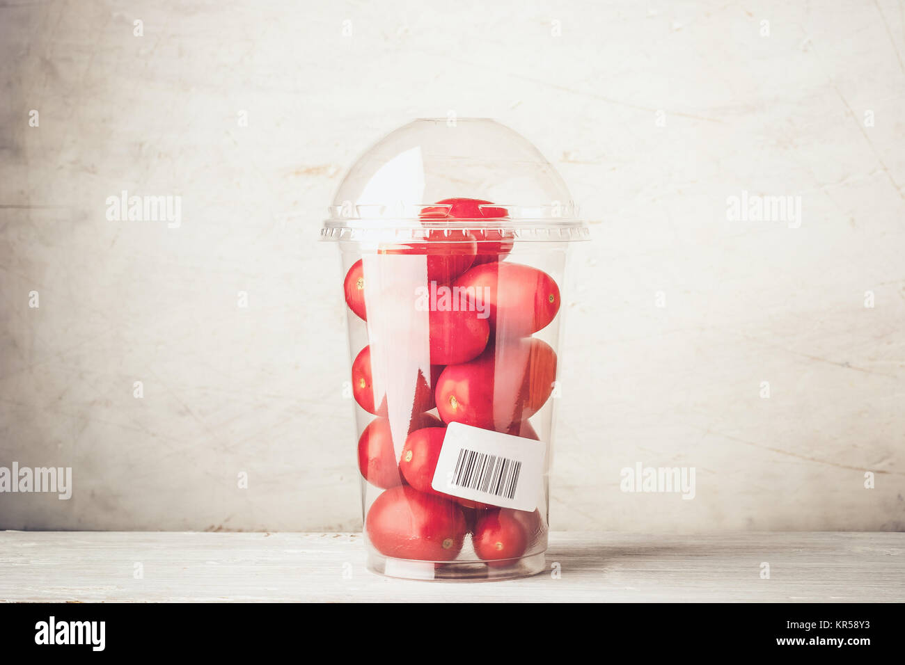 Tomatoes in the plastic package horizontal Stock Photo - Alamy