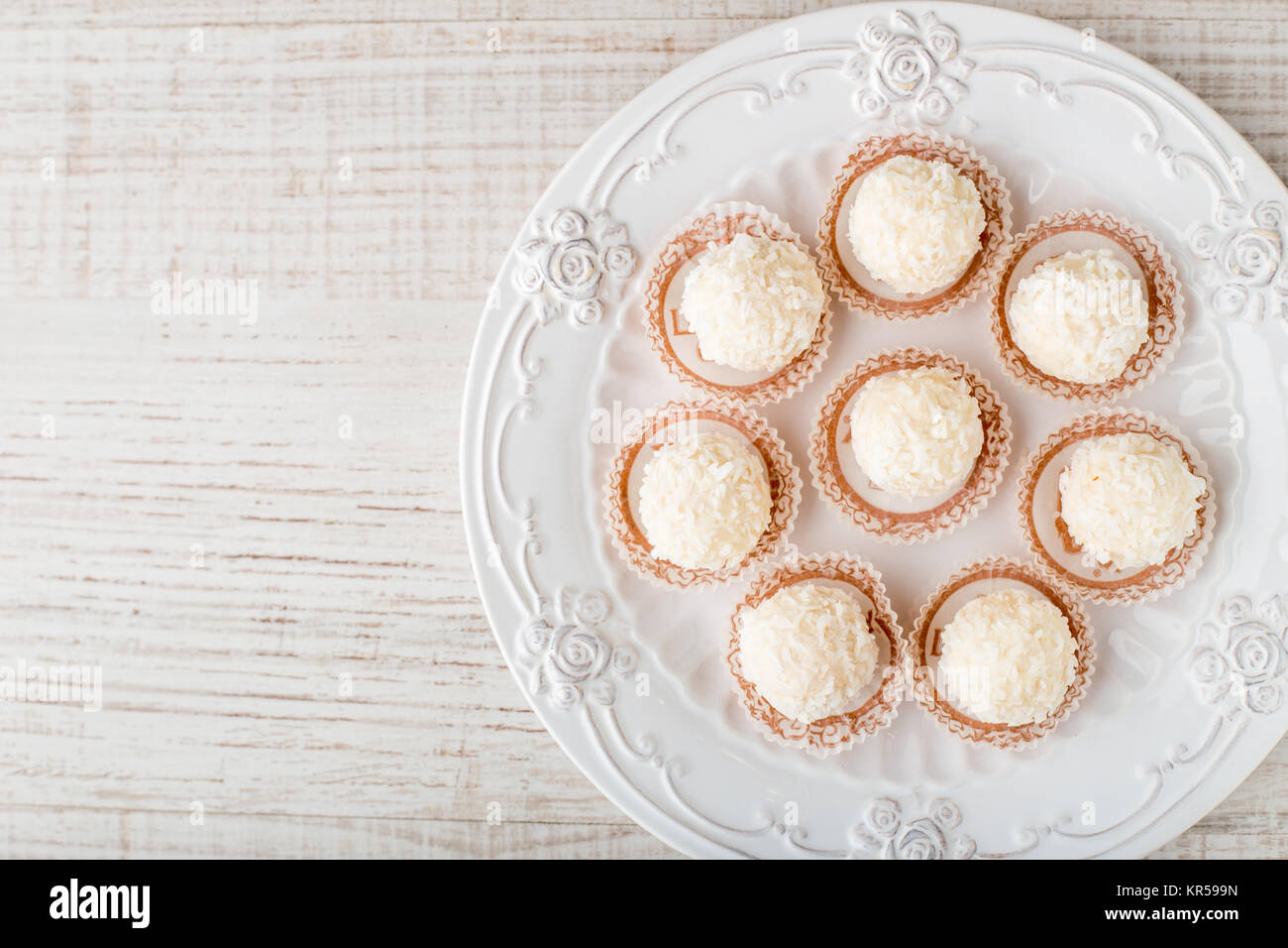 Candy coconut flakes on a plate Stock Photo - Alamy