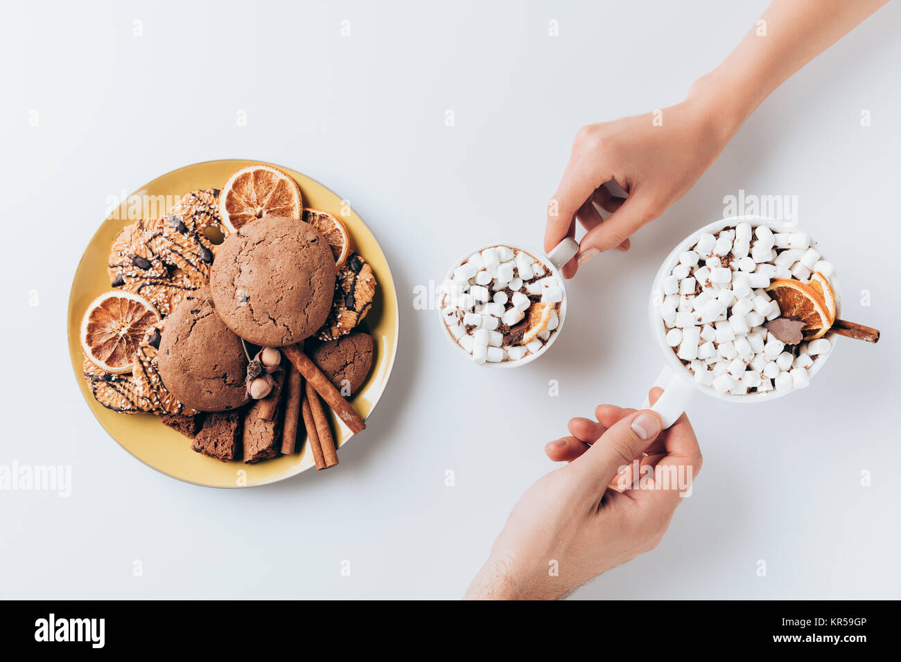 hands with cacao and cookies Stock Photo - Alamy