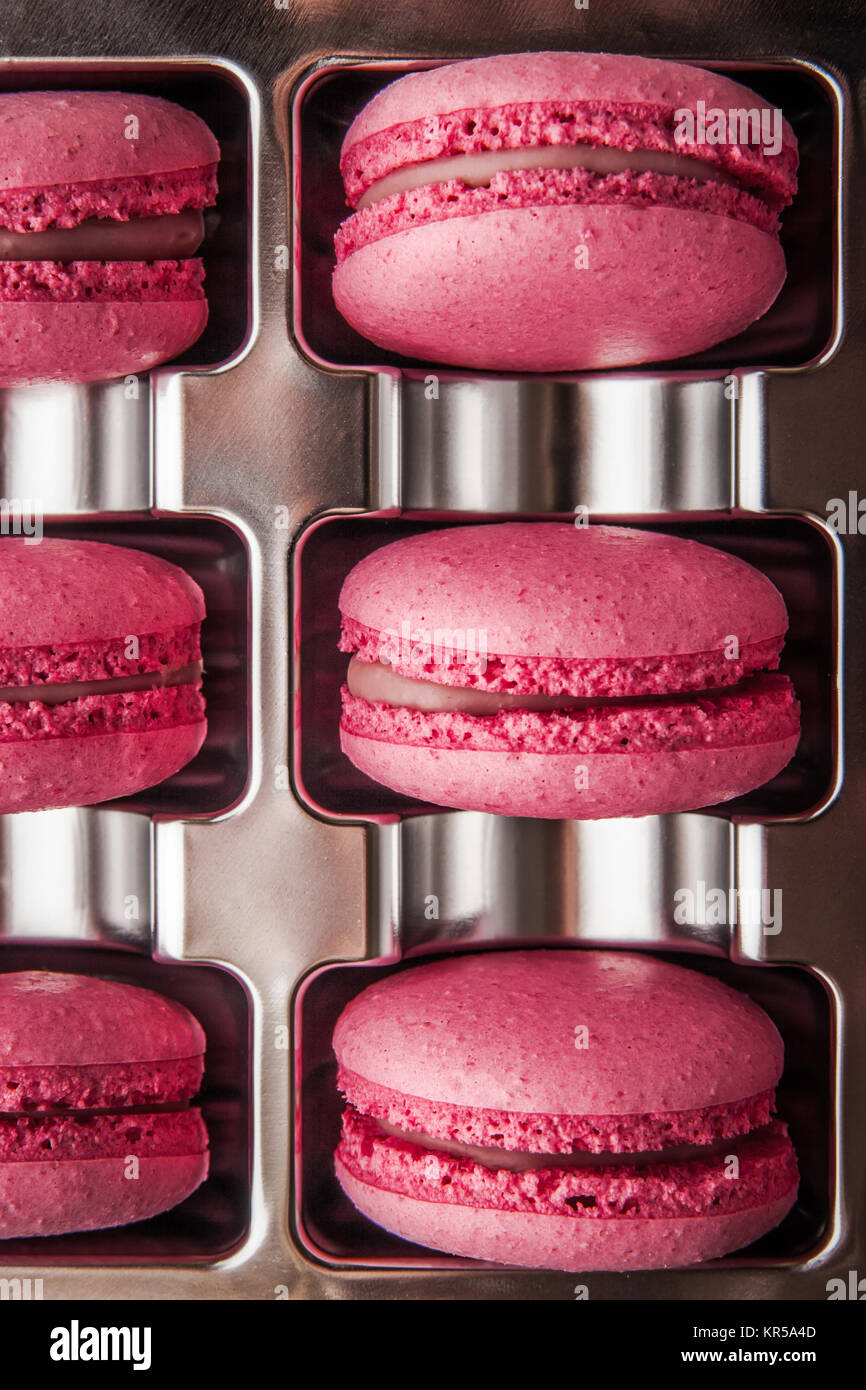 Macaroon raspberry in a box of foil Stock Photo - Alamy