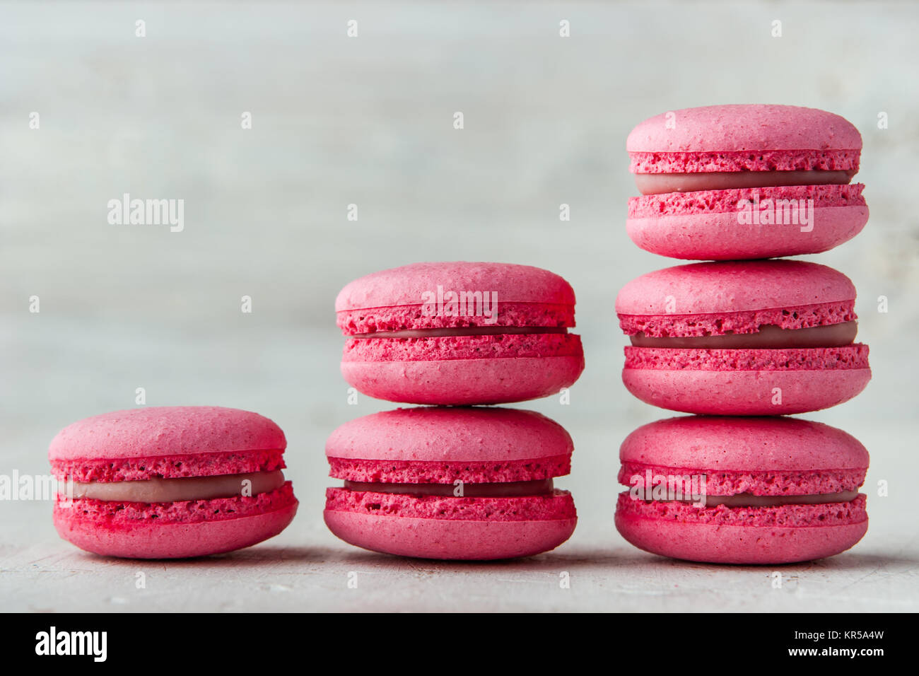 Pink macaroon on a white background Stock Photo - Alamy