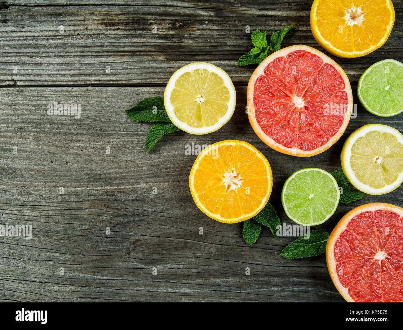 Fruit on rustic wood background Stock Photo - Alamy