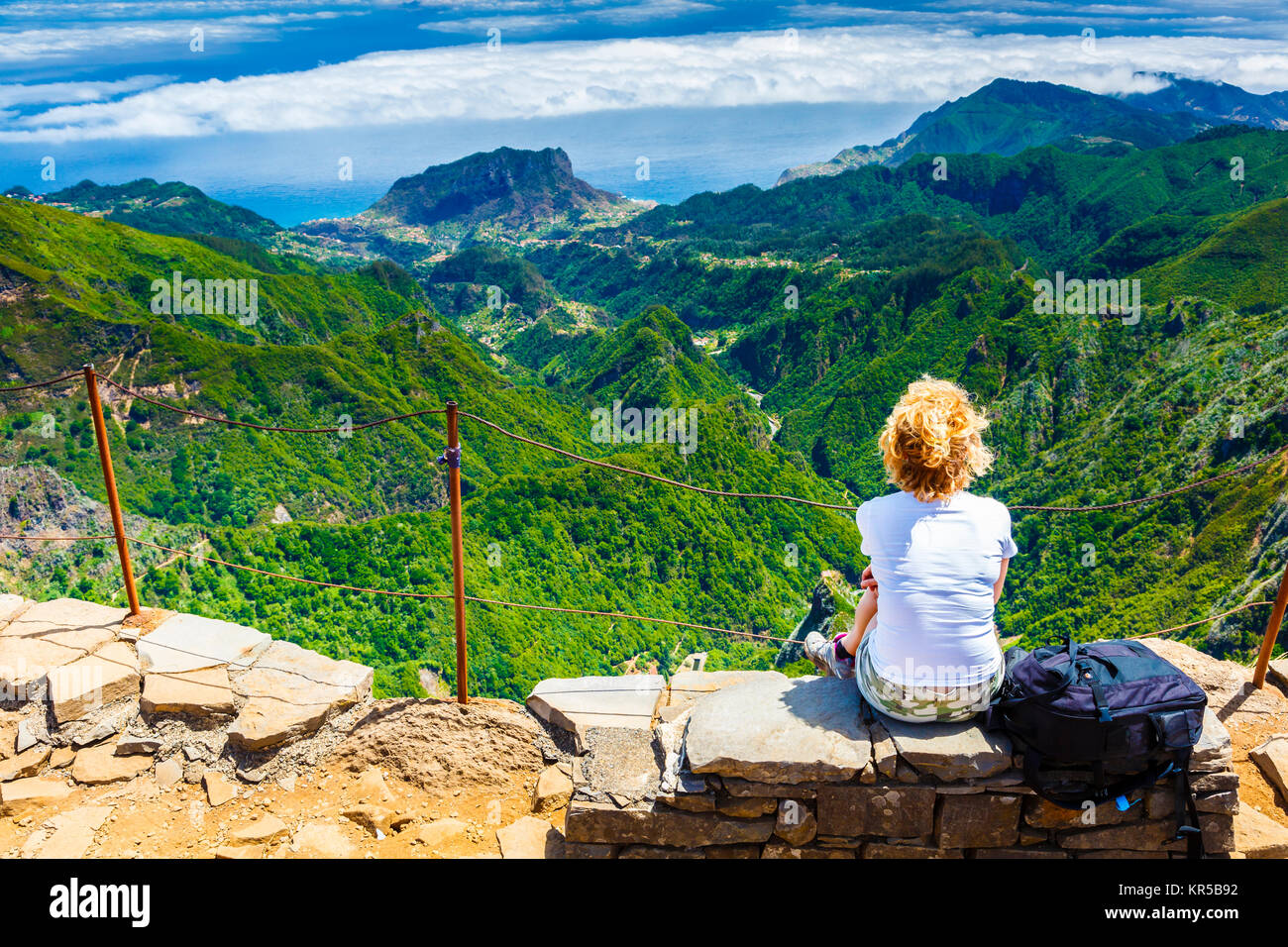 Woman in a mountain viewpoint. Faial area view from Pico do Arieiro ...
