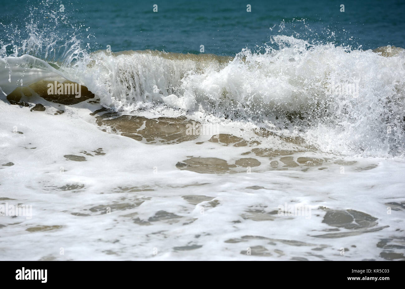Wave of the ocean on the sand beach Stock Photo - Alamy