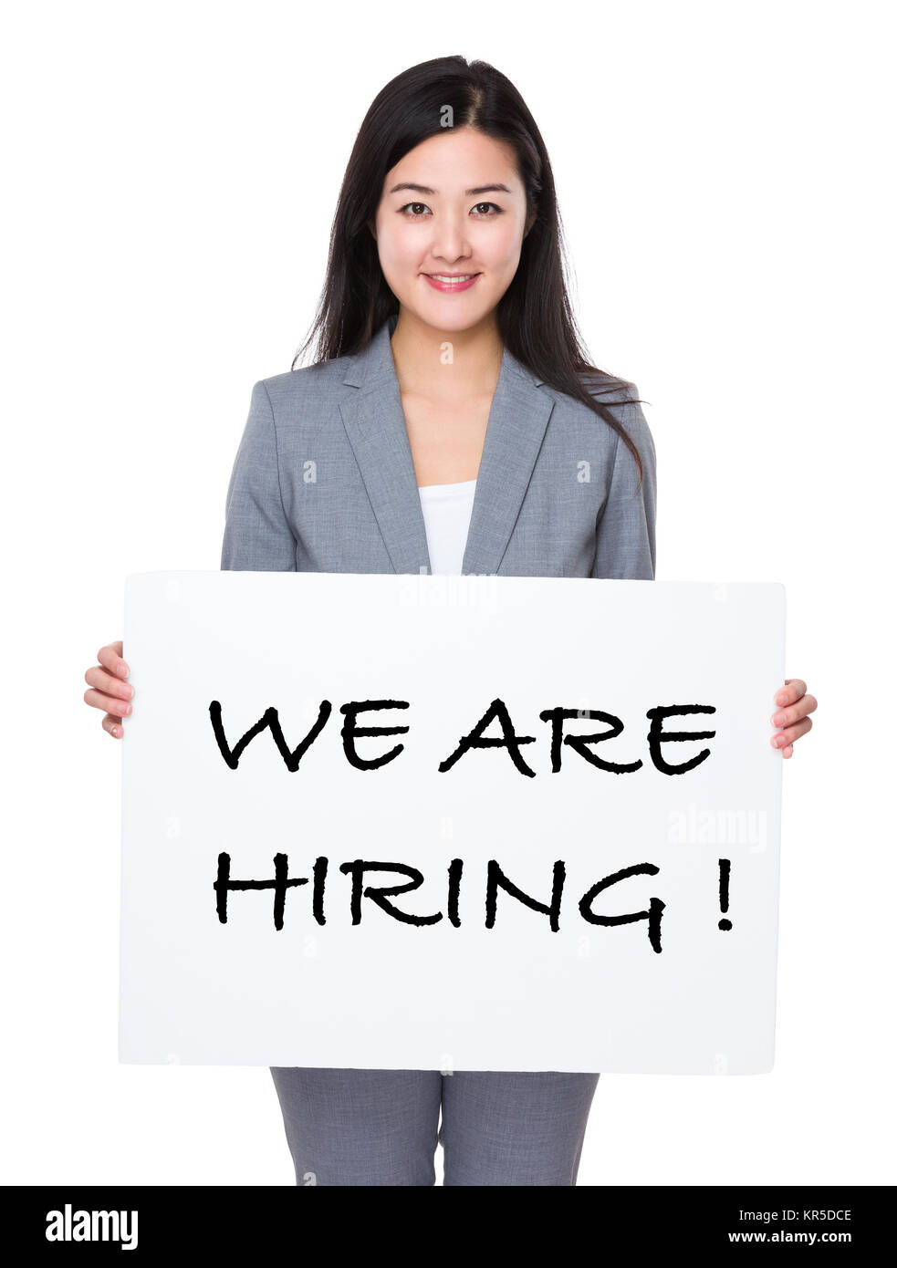 Businesswoman showing a poster showing with we are hiring phrases Stock ...