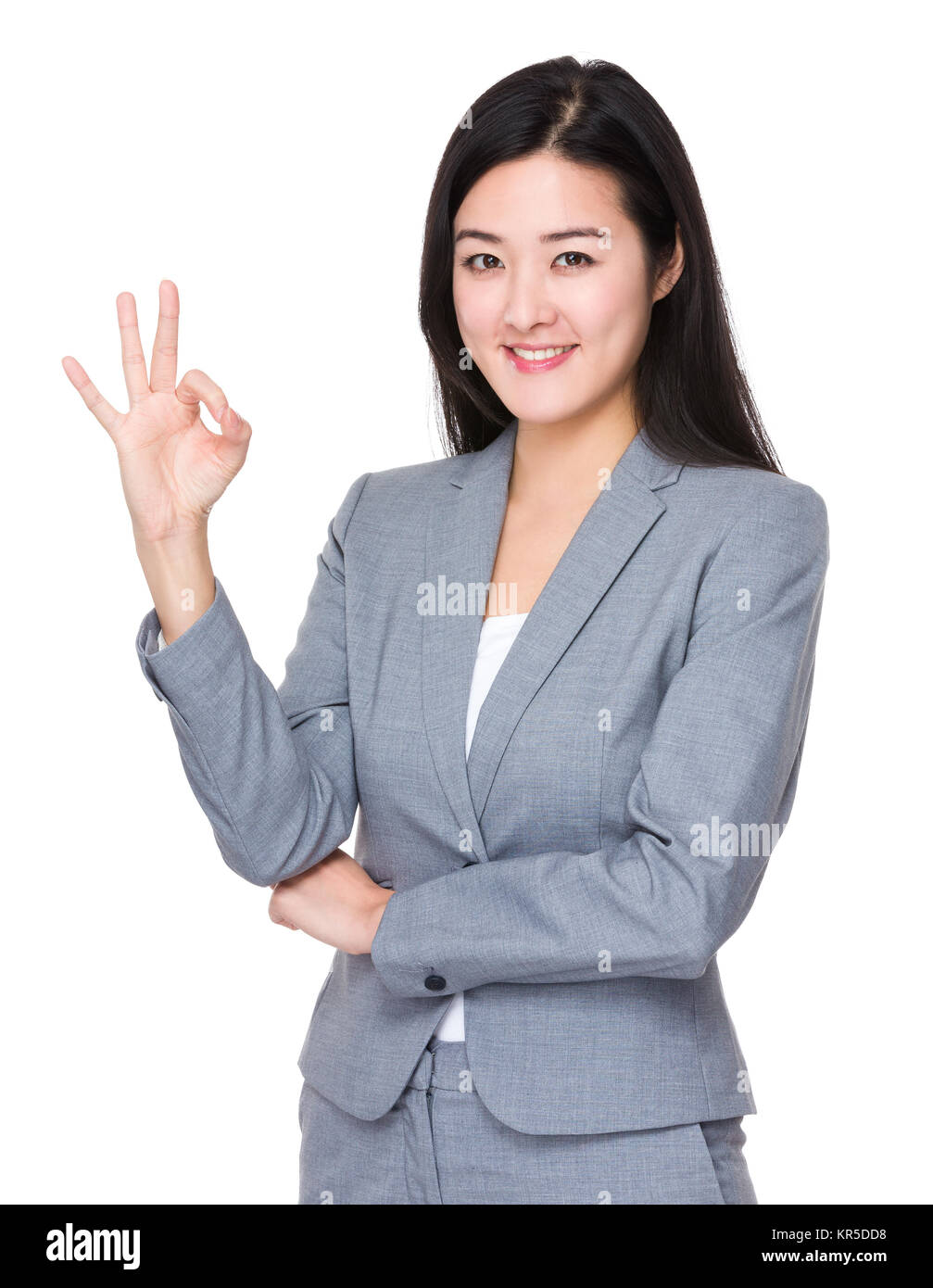Young businesswoman with ok sign gesture Stock Photo - Alamy
