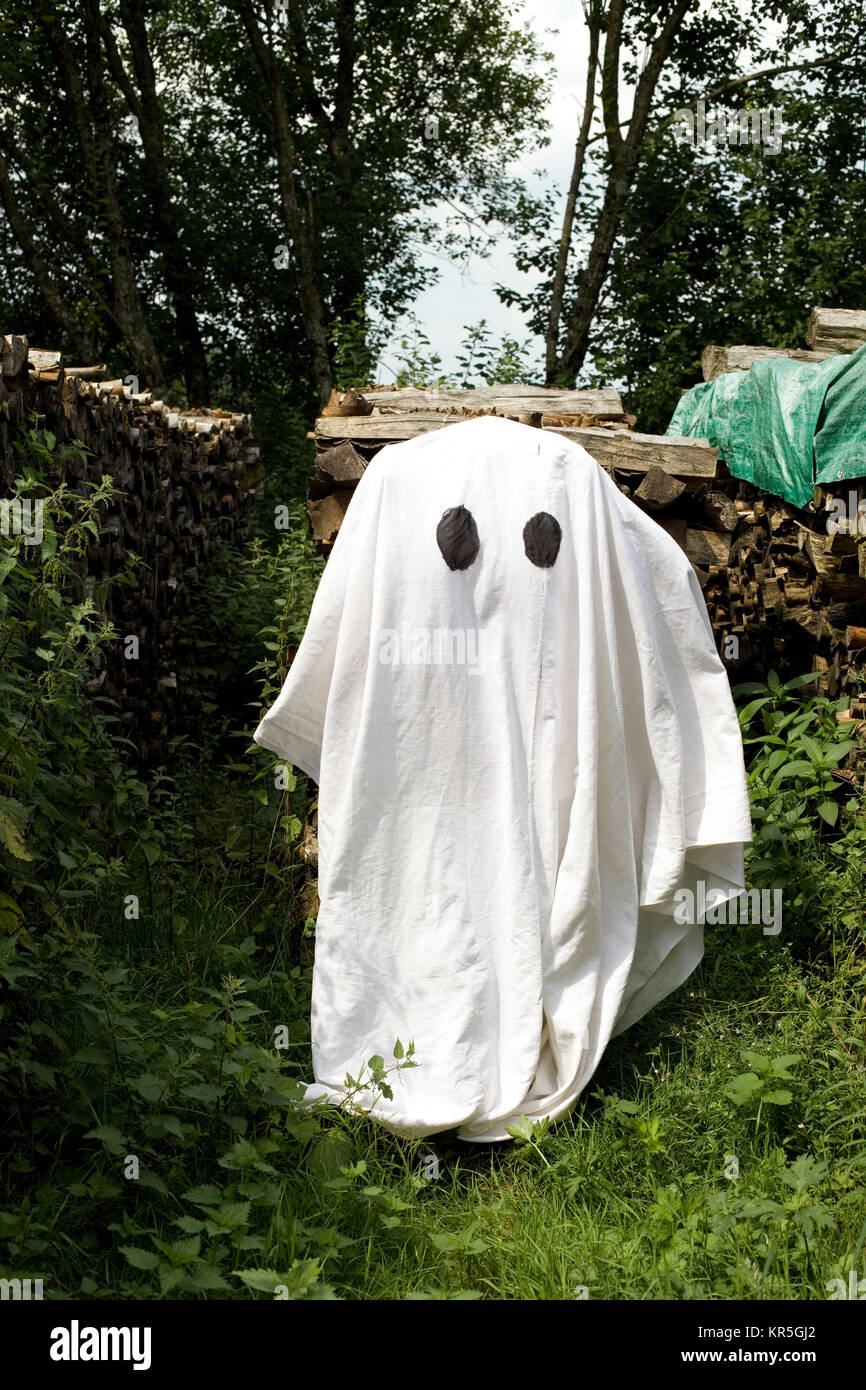 white ghost in front of wood stacked Stock Photo - Alamy