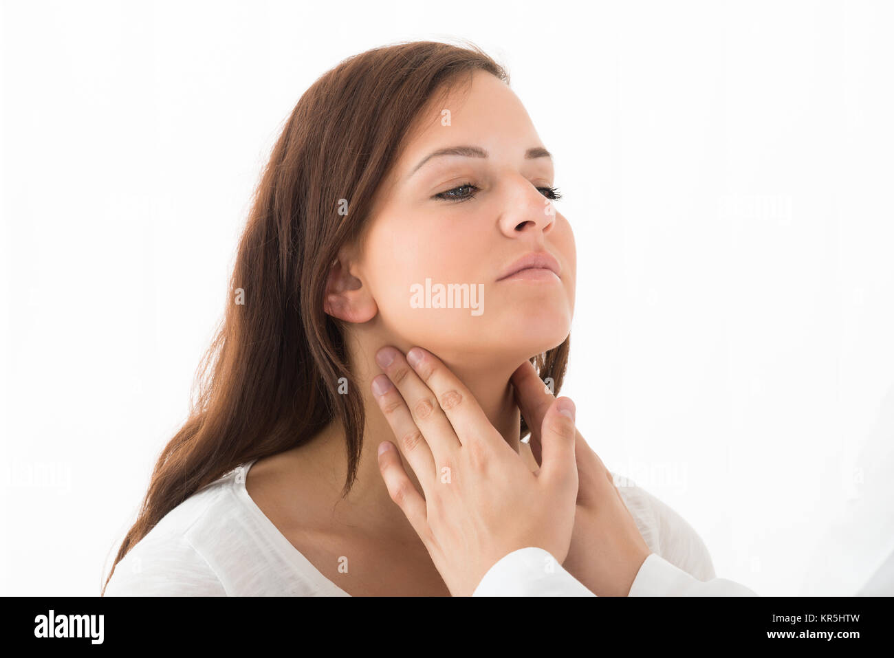 Doctor Checking Thyroid Of A Young Woman Stock Photo - Alamy